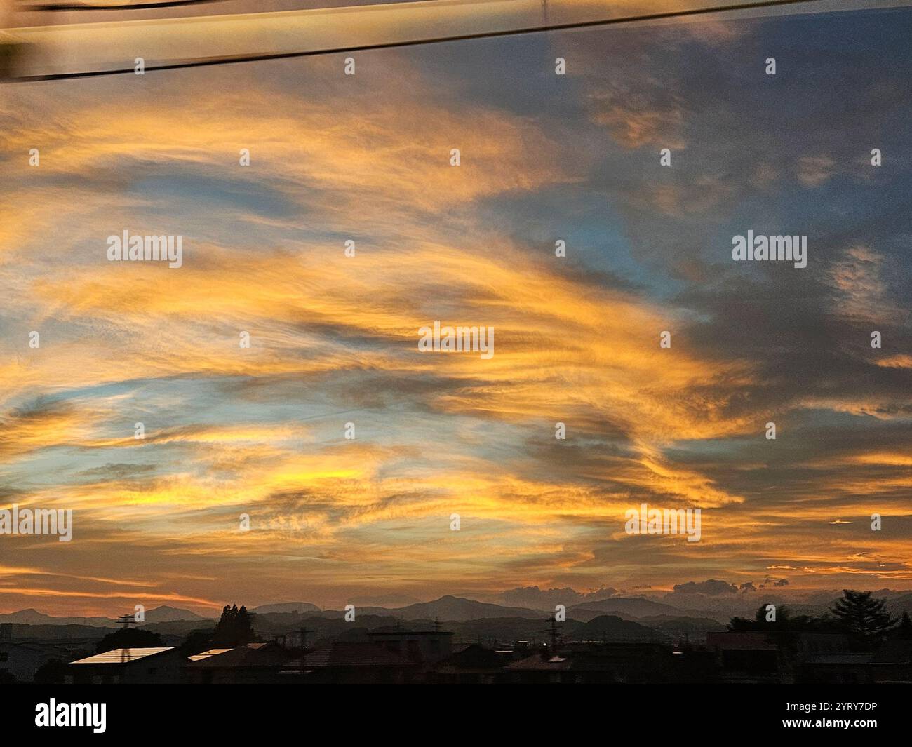 The fire-colored clouds in the sky, resembling a phoenix, observed ...