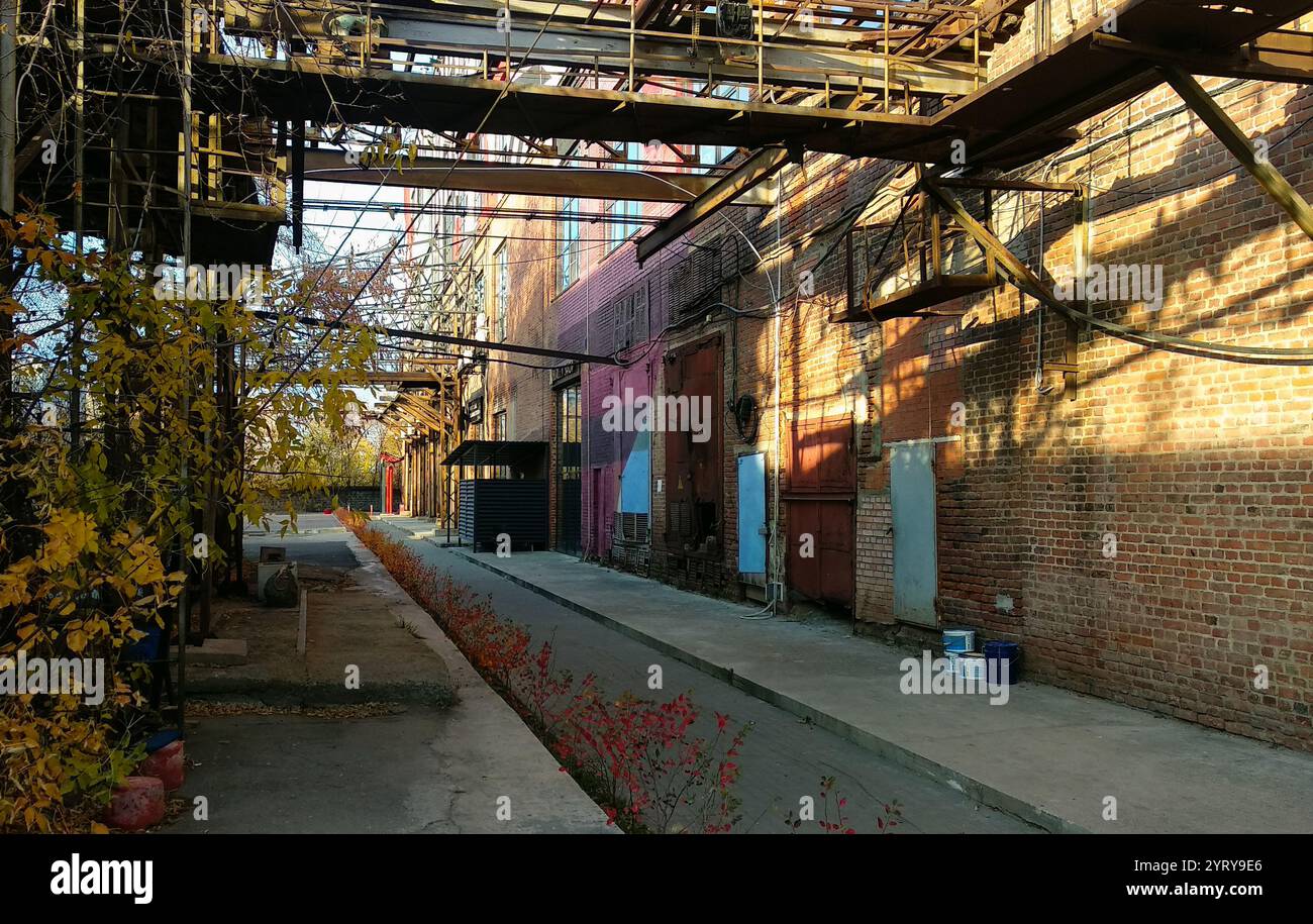 View of the backyard and the facade of the old factory Stock Photo - Alamy