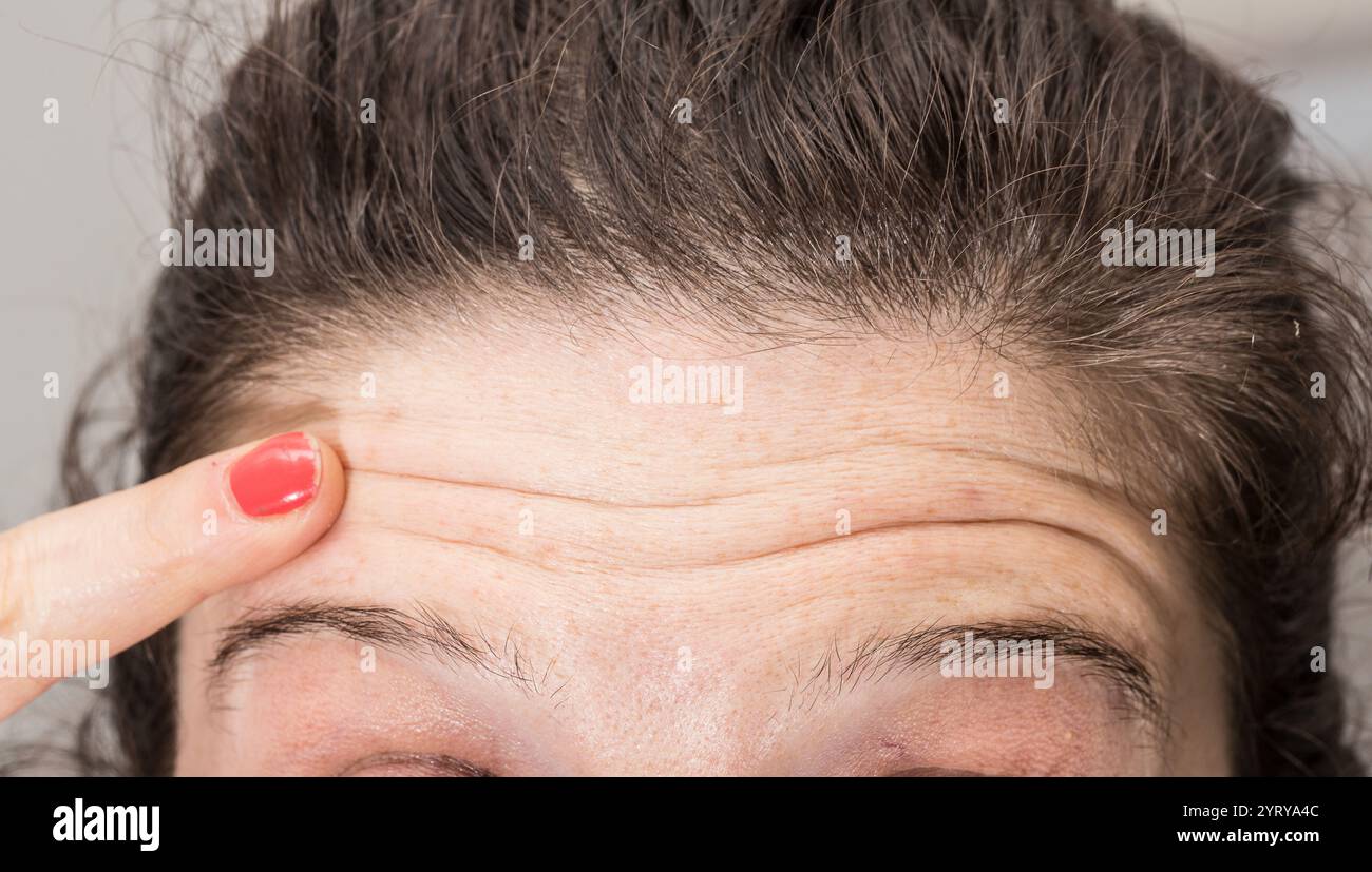 Finger forehead woman hi-res stock photography and images - Alamy