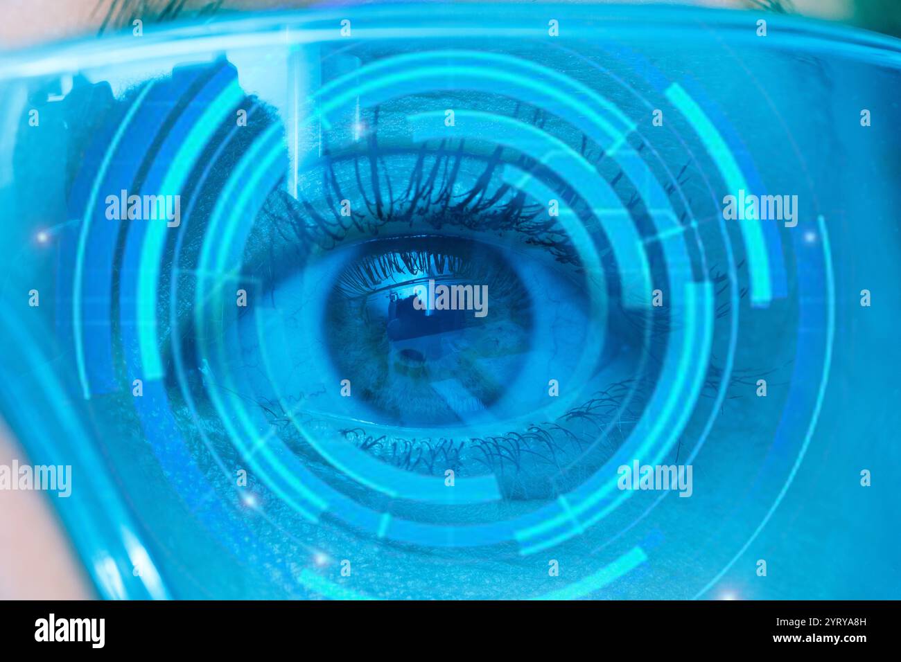 Close-up of an eye scanning a futuristic digital interface with ...