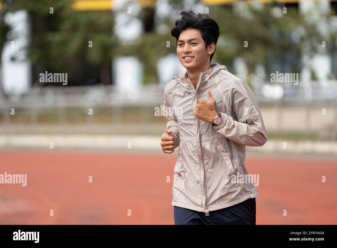 Energetic Young Man Jogging Outdoors in Sportswear for a Healthy ...
