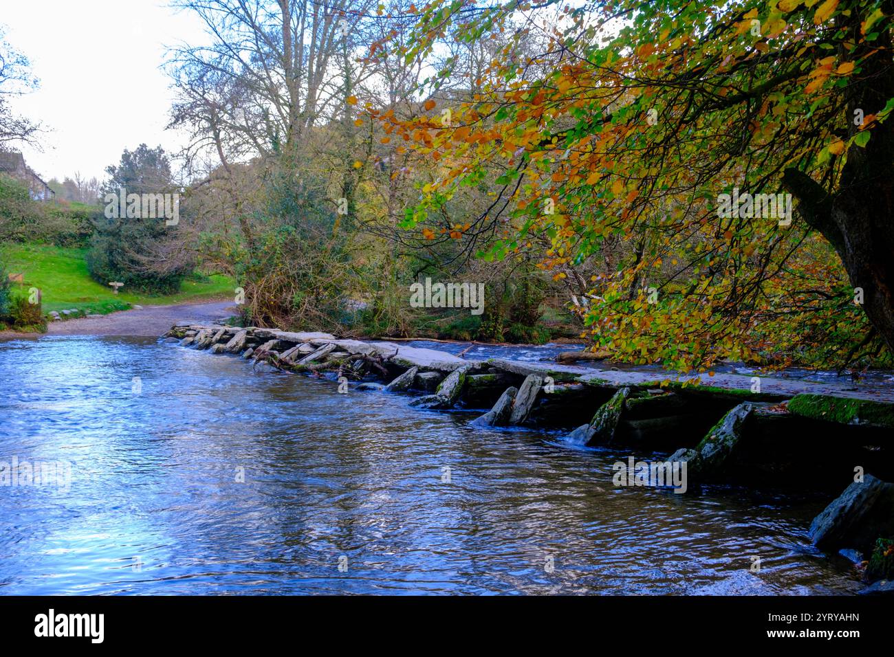 Signs of autumn at Tarr Steps clapper bridge after rain in Exmoor ...