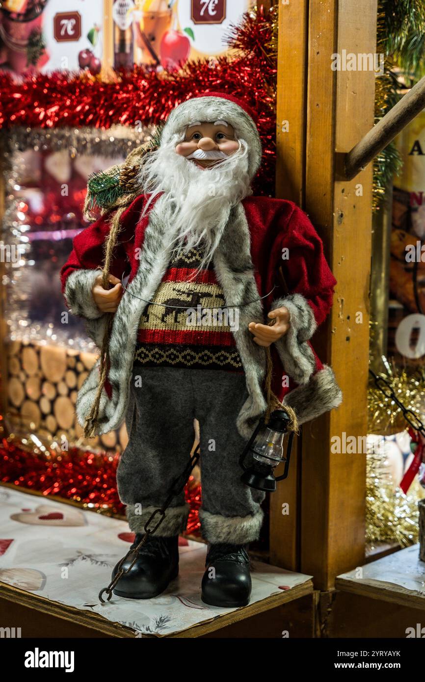 Christmas market stall with Santa figurine Stock Photo - Alamy