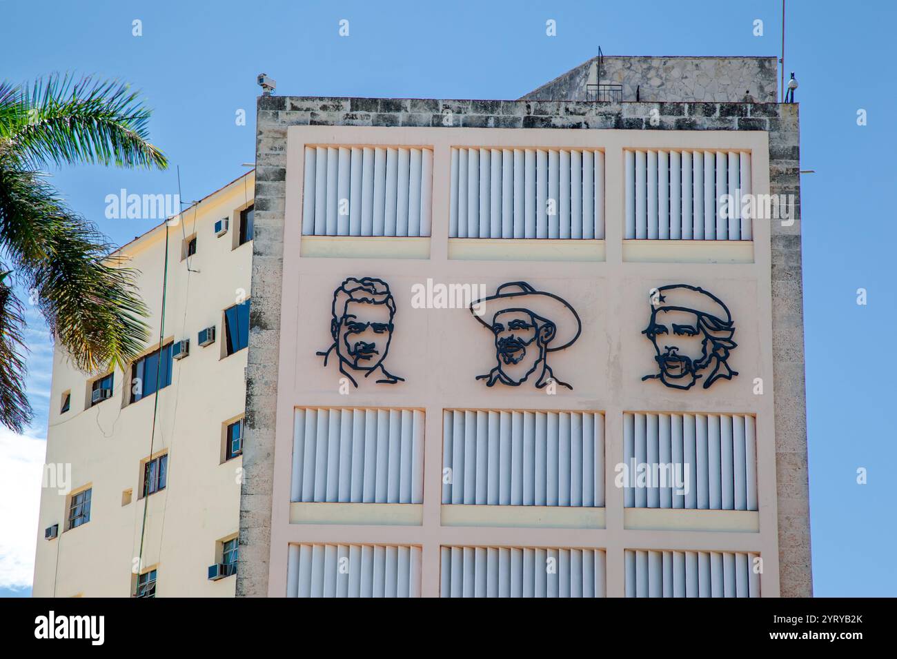 Three Revolution heroes faces on a wall of a building in Belgica avenue ...