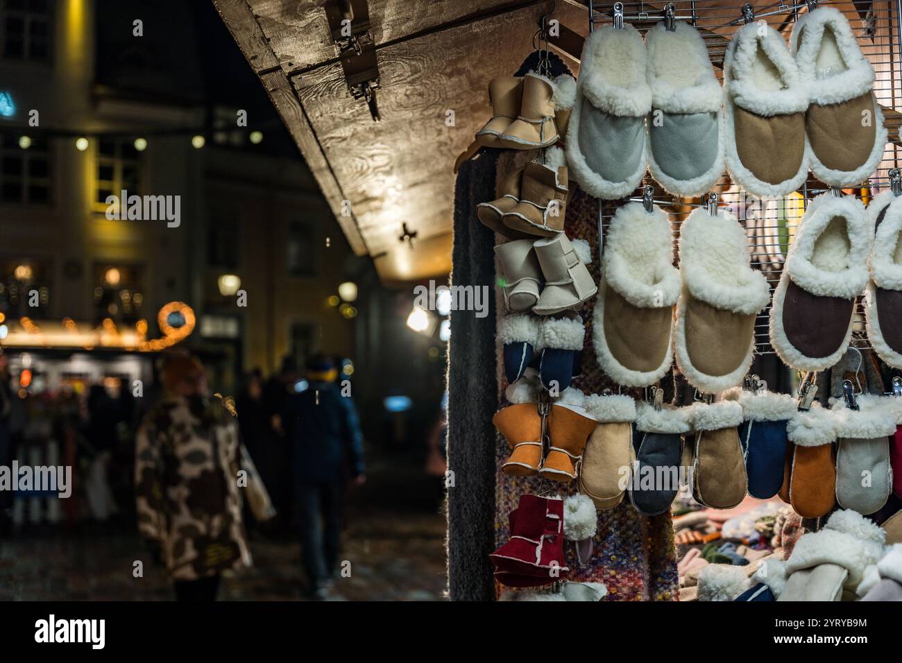 Cozy winter slippers on display at a night market stall Stock Photo - Alamy