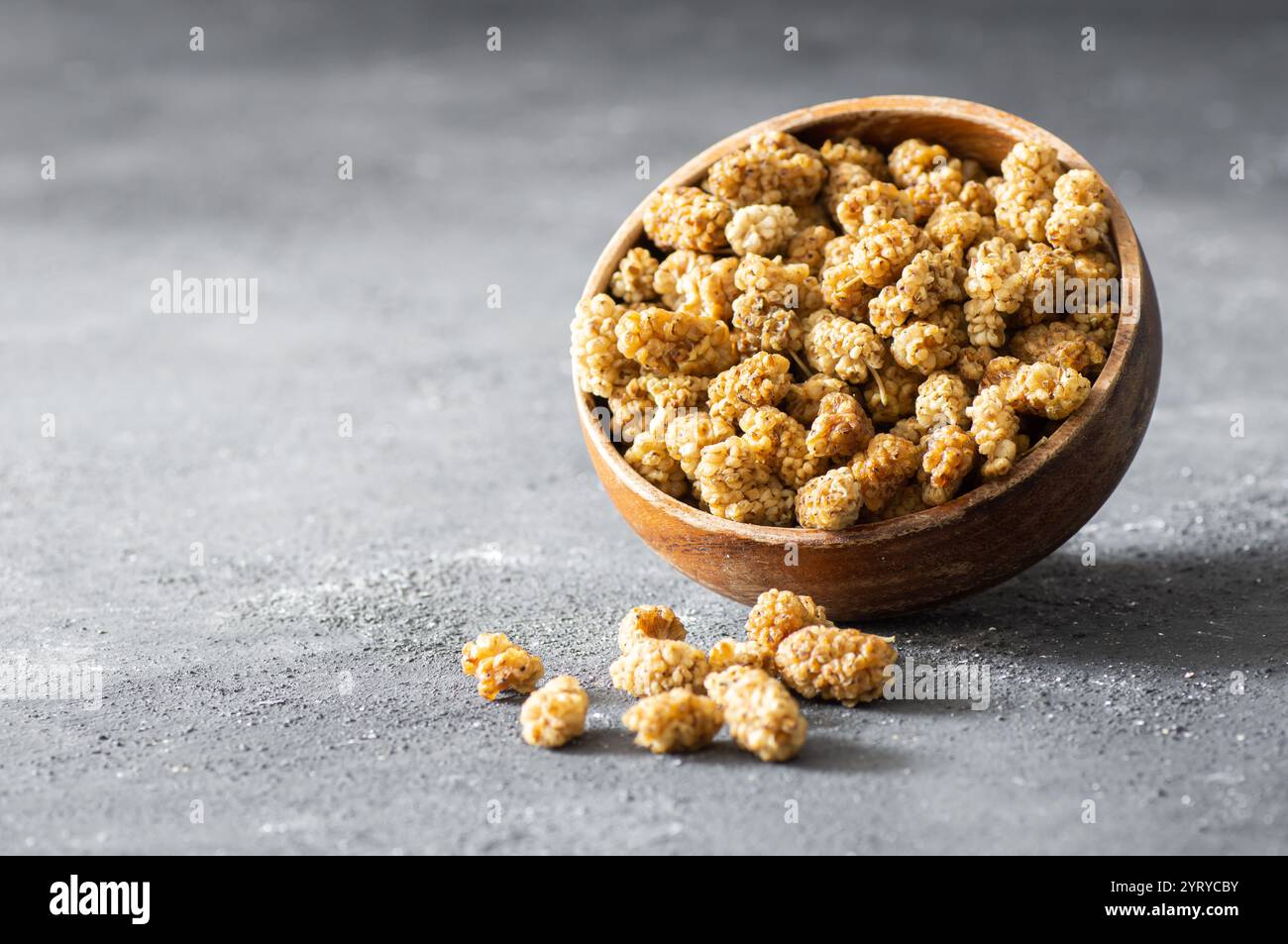Dried white Mulberry fruits on rustic background, healthy snack fruit ...