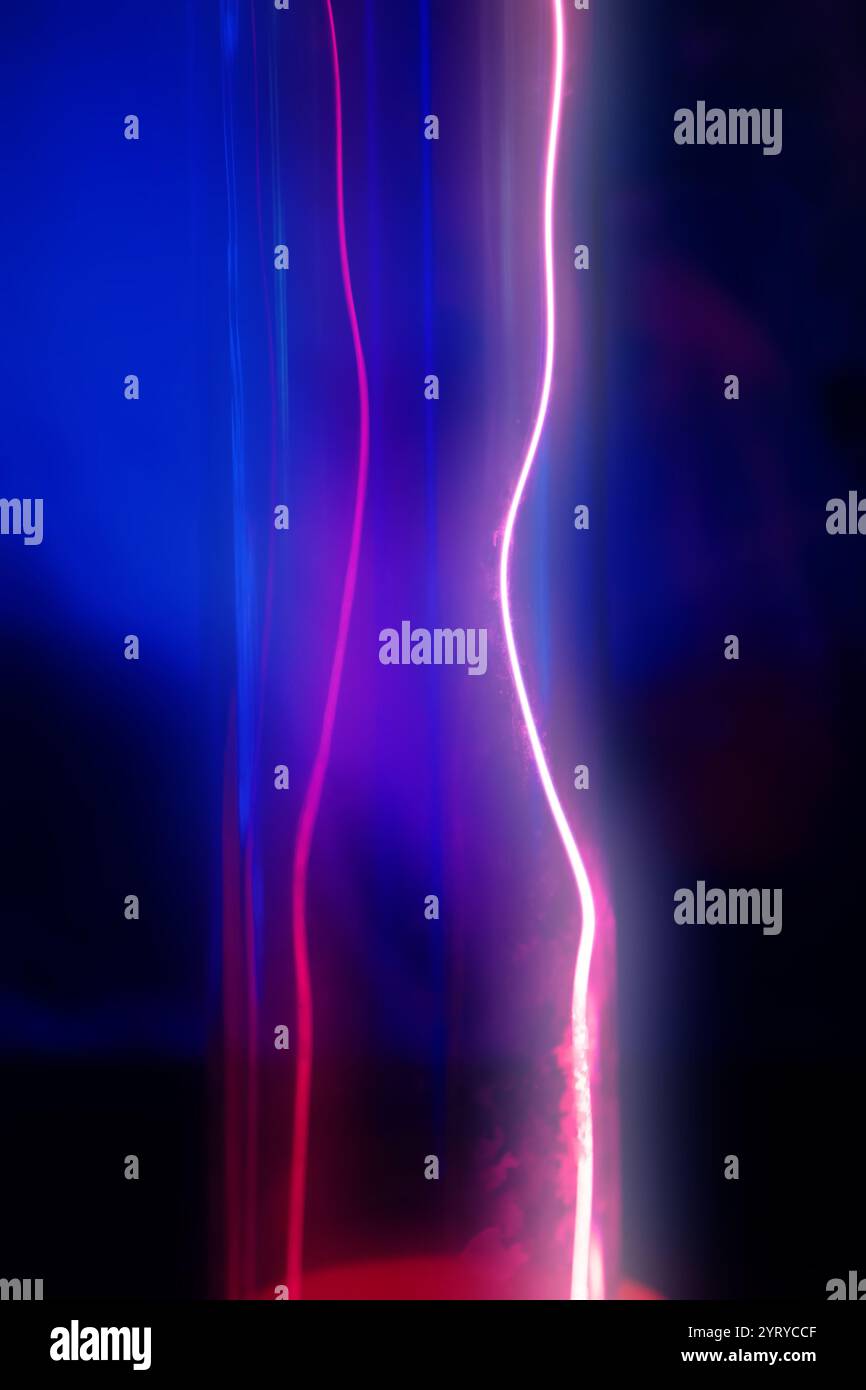 A glass tube with red and blue light from the gas Stock Photo - Alamy