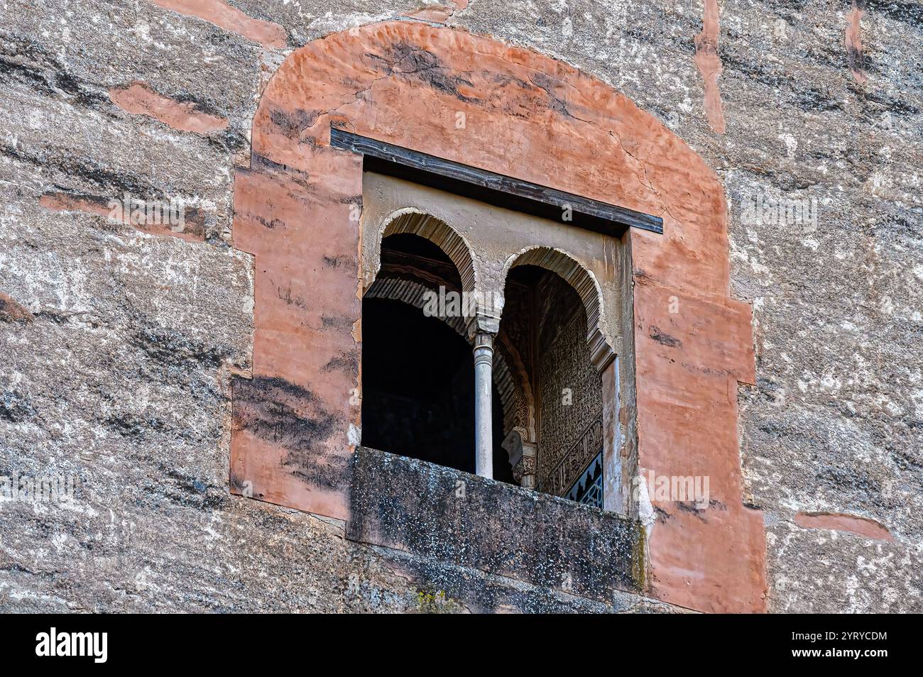 Islamic style window in a stone fortified tower part of the Alhambra ...