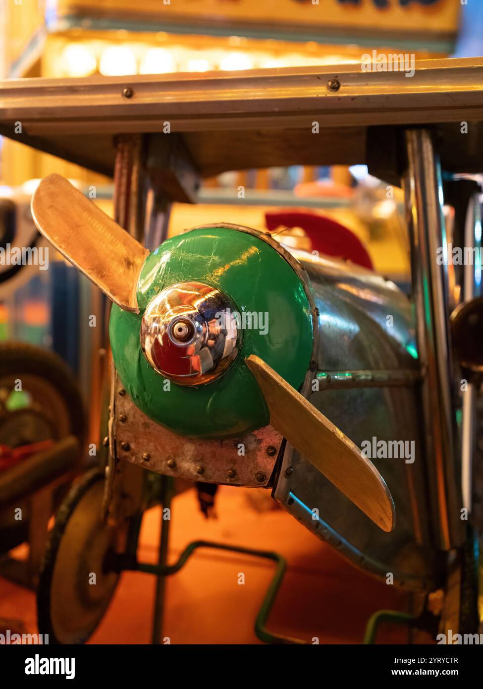 a model airplane child's ride at a funfair Stock Photo - Alamy