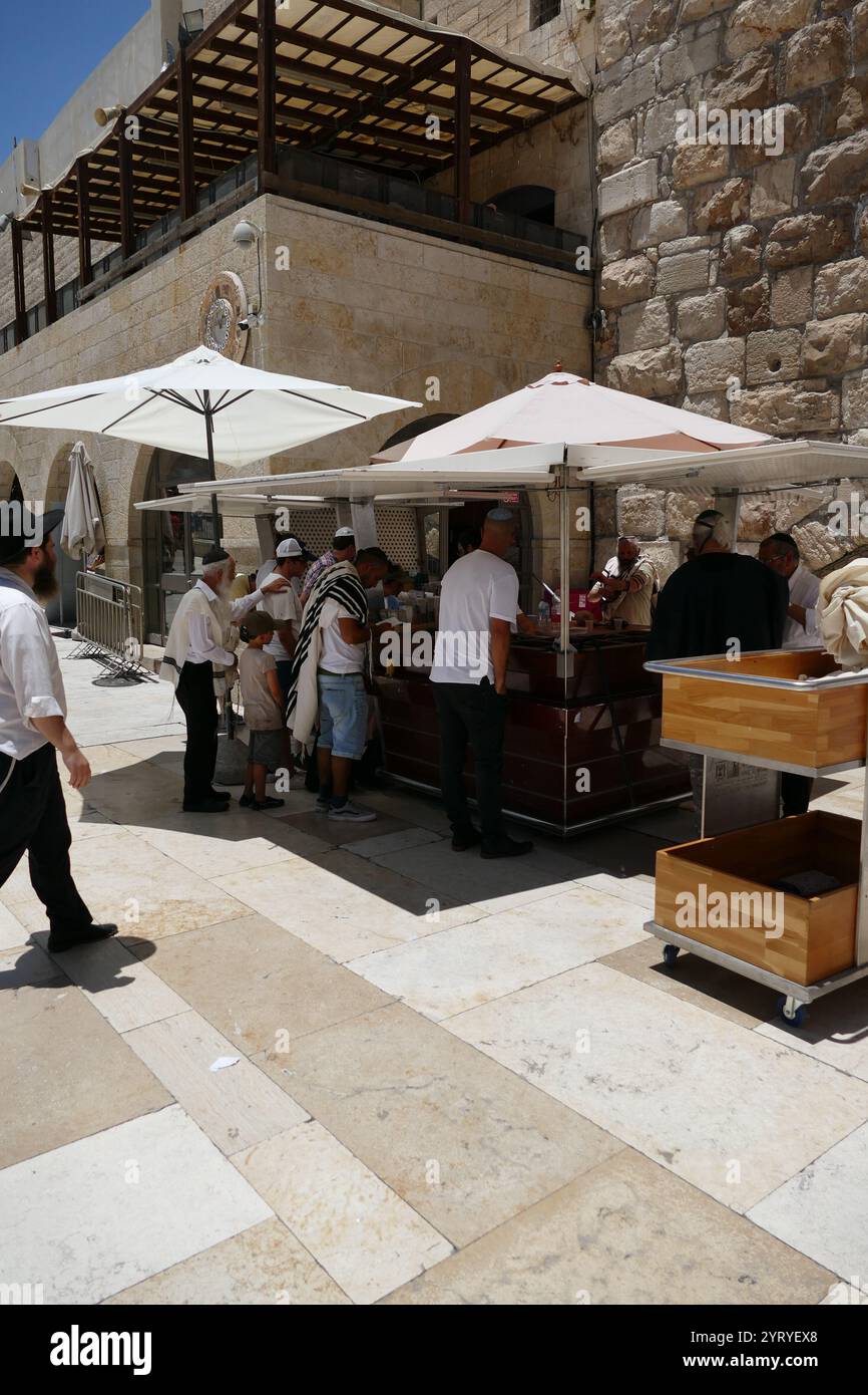 Jews putting on Tefillin during prayers at the Western Wall, (Wailing ...