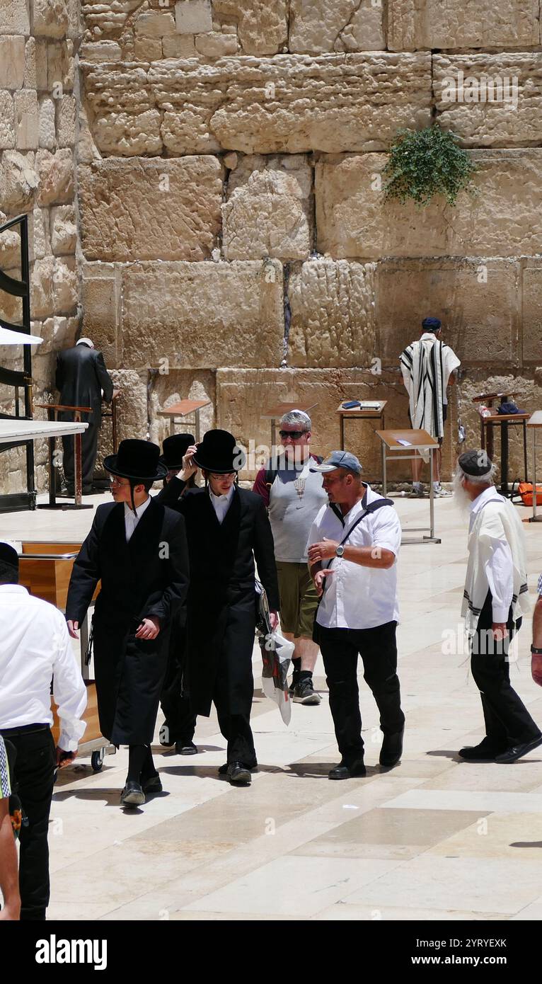 Jews pray at the Western Wall, (Wailing Wall, or Kotel), an ancient ...