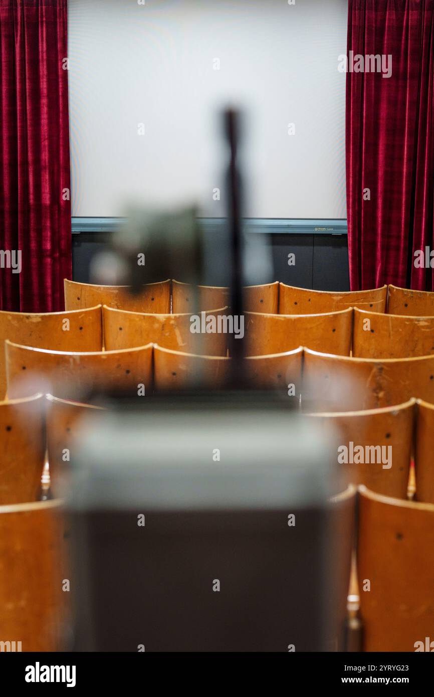 Close-up of a vintage film projector in a cinema hall, highlighting ...
