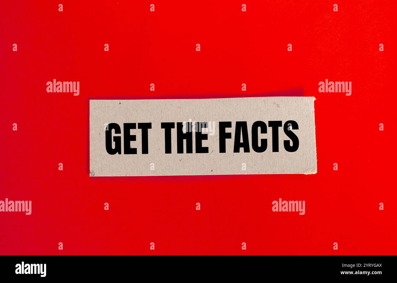 Get the facts message written on paper piece with red background ...