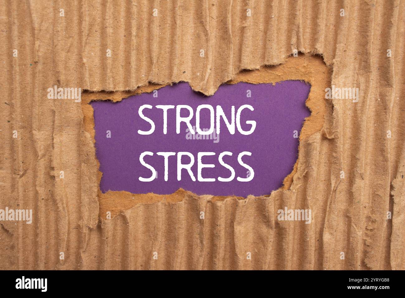 Strong stress message written on ripped torn cardboard paper with purple background. Conceptual ...