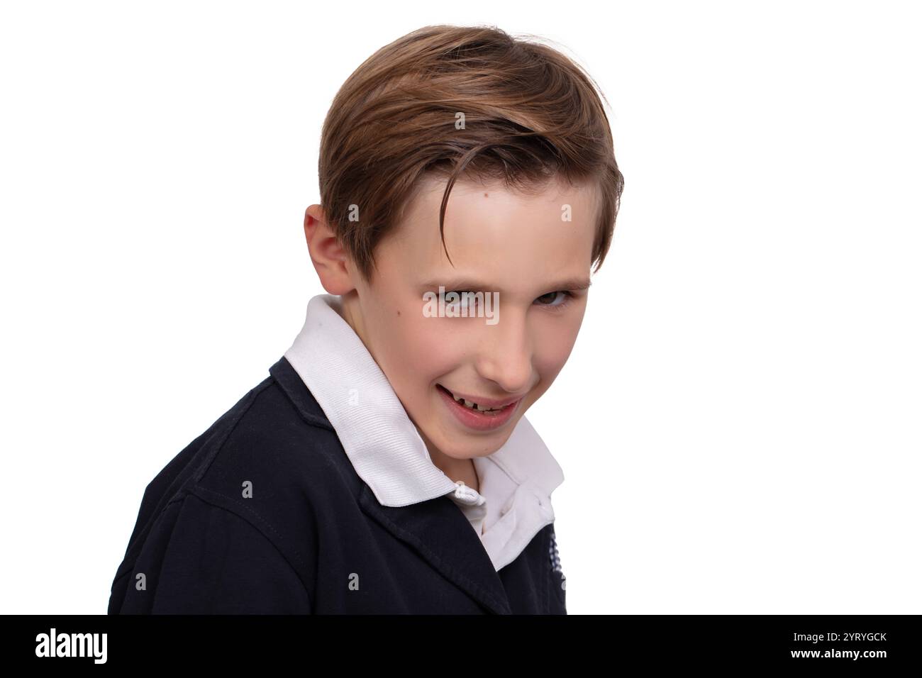 Portrait of a cheerful boy with a sly look on a white background close ...