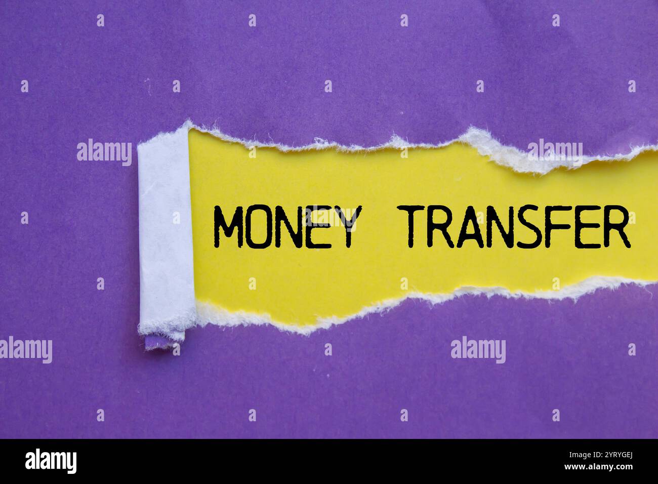 Money transfer message written on ripped torn purple paper with yellow ...