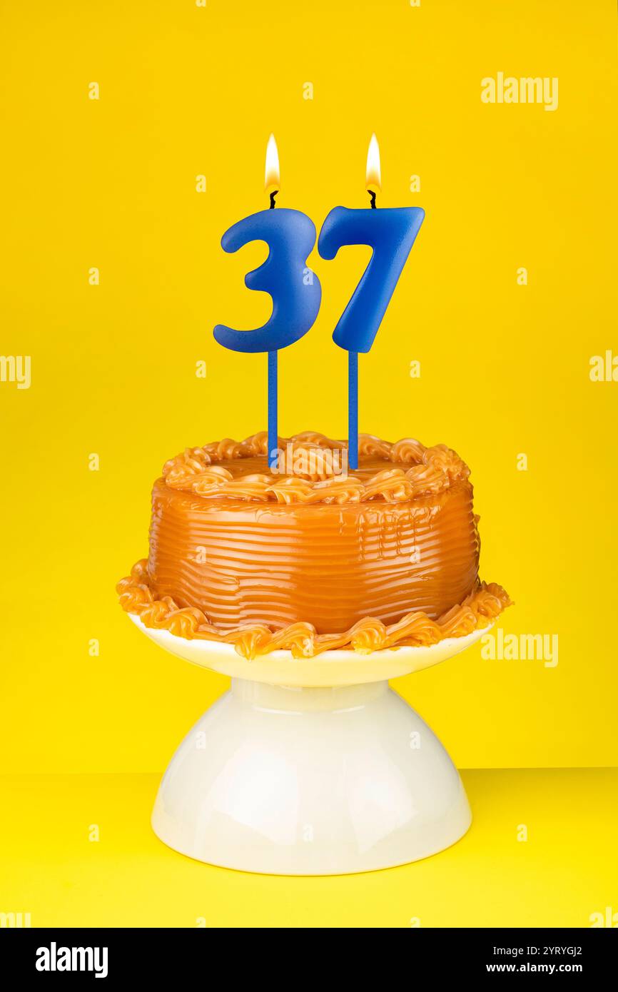 Happy birthday cake with number 37 candle - Card on a yellow background ...