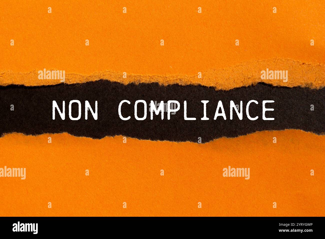 Non compliance message written on ripped torn orange paper with black background. Conceptual non ...