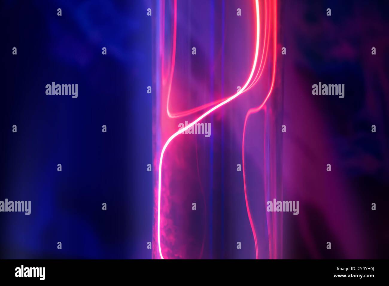 A glass tube with red and blue light from the gas Stock Photo - Alamy