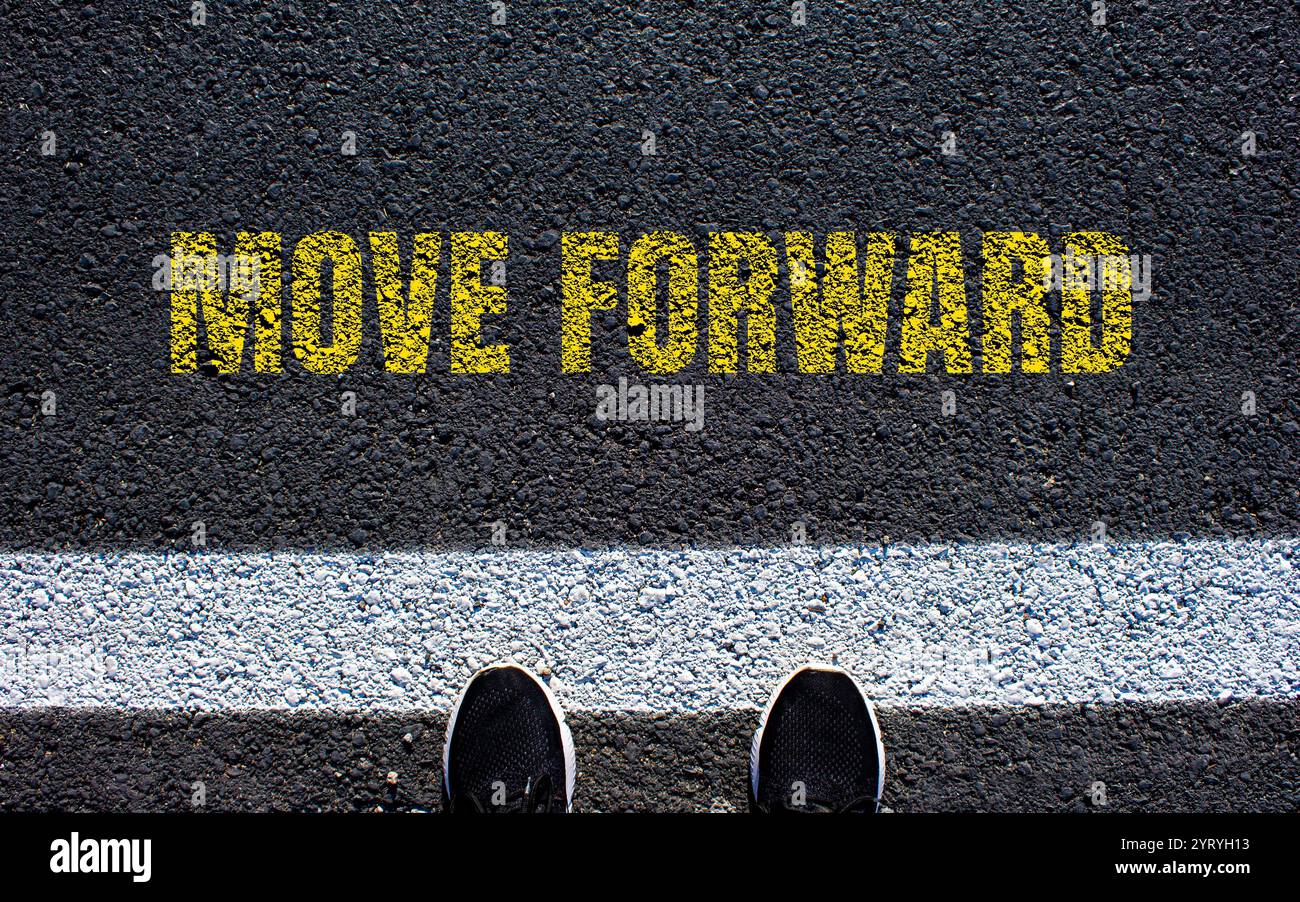 Move forward message written on asphalt road. Conceptual move forward symbol. Copy space Stock ...