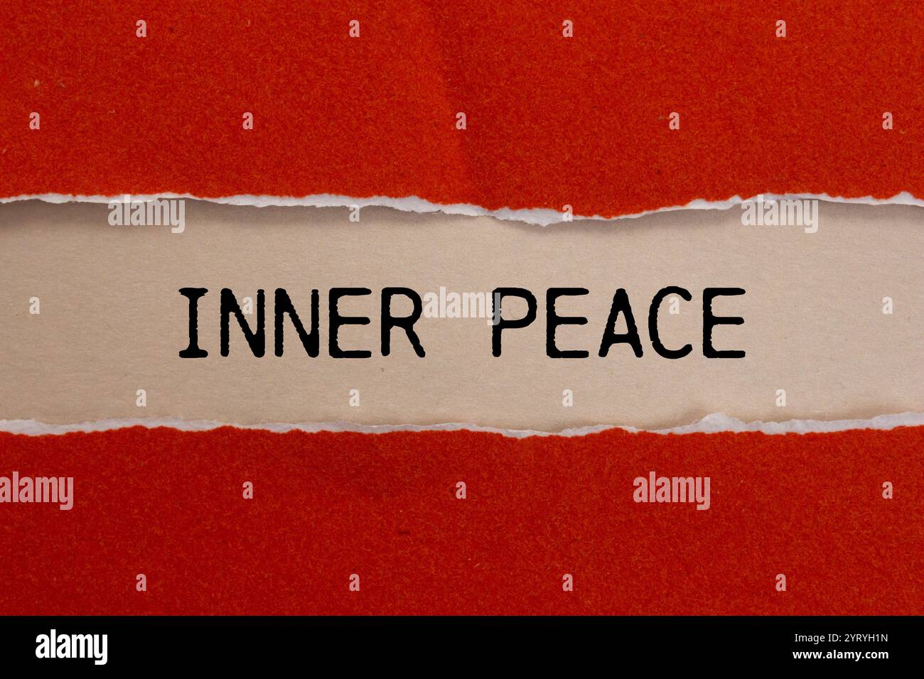 Inner peace message written on ripped torn red paper with beige ...