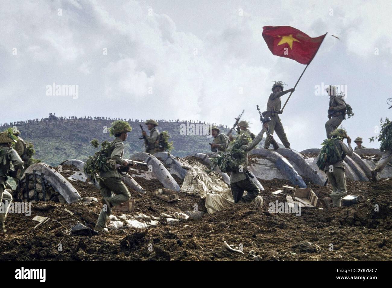 Victorious Viet Minh soldiers waving their flag on top of the French ...