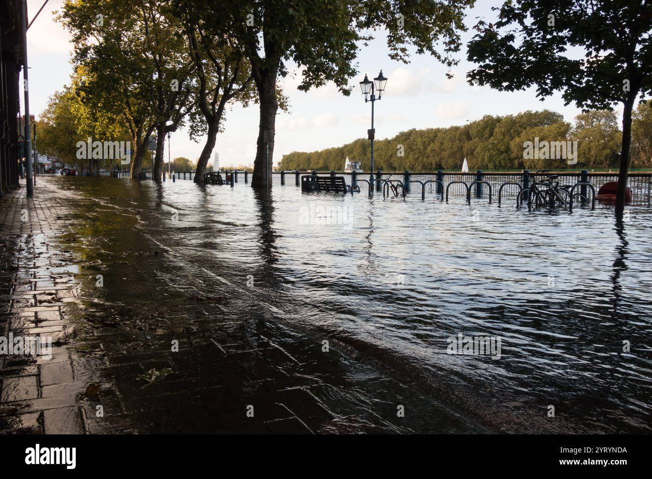 River Thames supermoon high water flooding on Putney Embankment in west ...