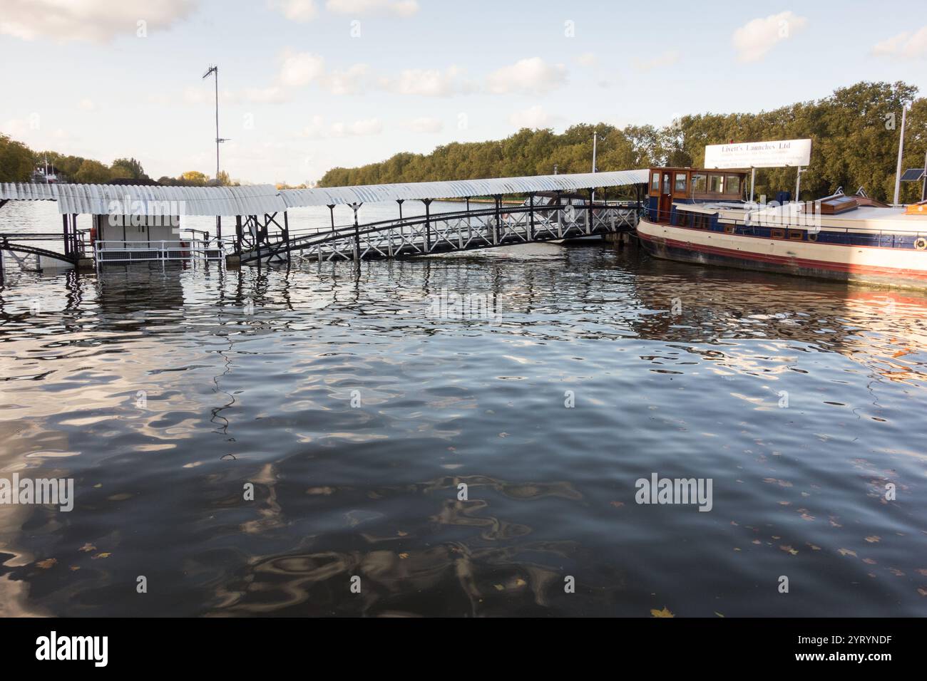 A flooded and submerged Putney Pier in west London after a supermoon ...