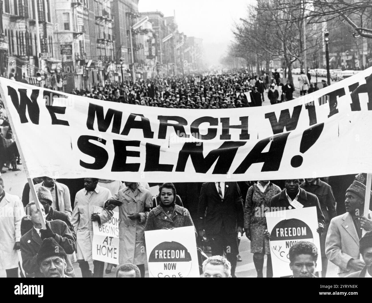 Marchers carrying banner lead way as 15,000 parade in Harlem / World ...