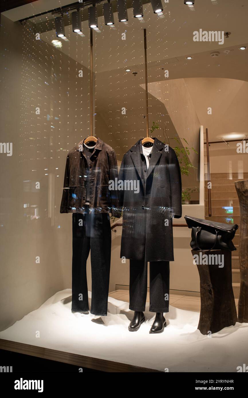 Male mannequin in store glass window display dressed casual autumn ...