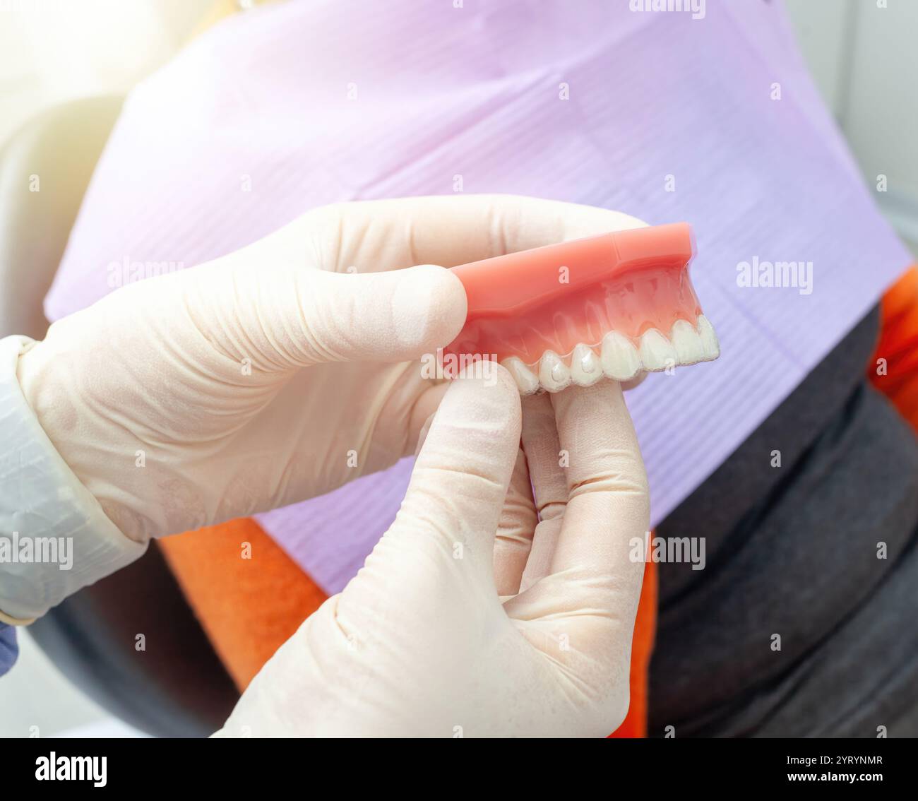 Dentist shows how teeth orthodontics works using an invisible aligner ...
