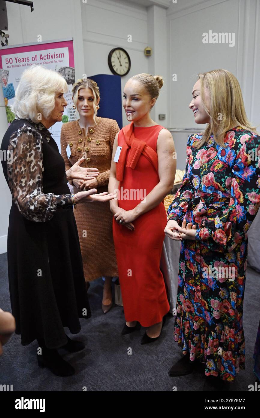 Queen Camilla speaks to (left to right) Ashley James, Katie Piper and ...