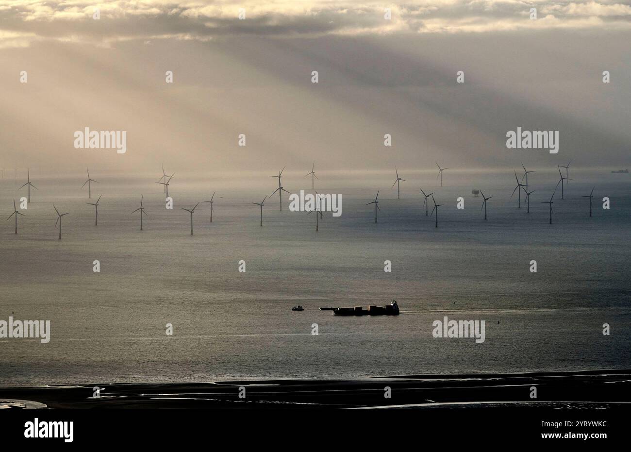 Ship sailing past an offshore wind farm hi-res stock photography and ...