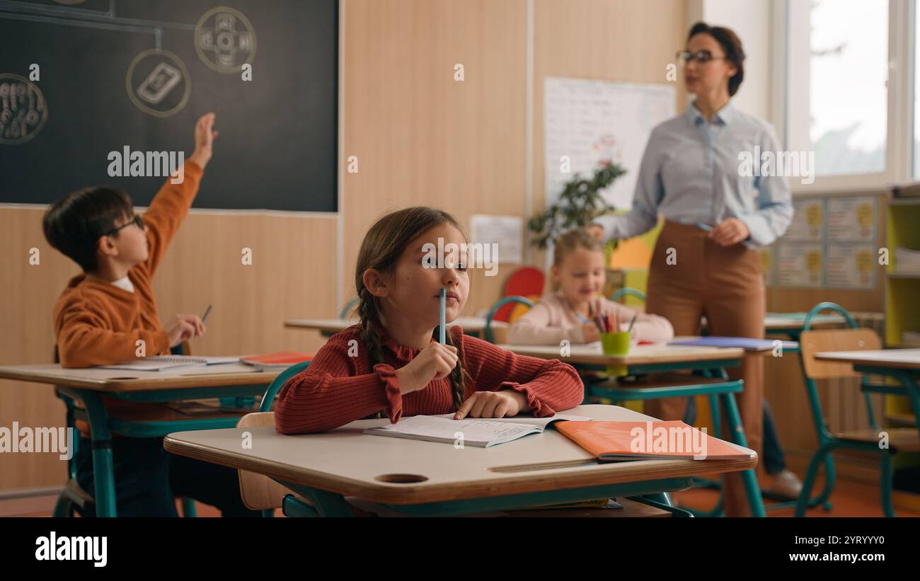 School class lesson children studying learning in classroom woman ...