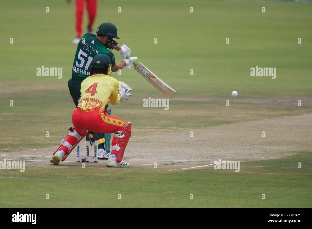 Pakistan's Sahibzada Farhan at the wicket in front of Zimbabwe's ...