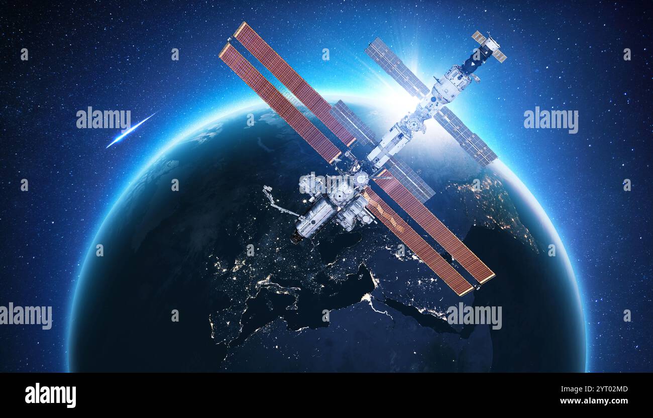 The ISS flies near blue night planet Earth at sunset. Space mission and ...