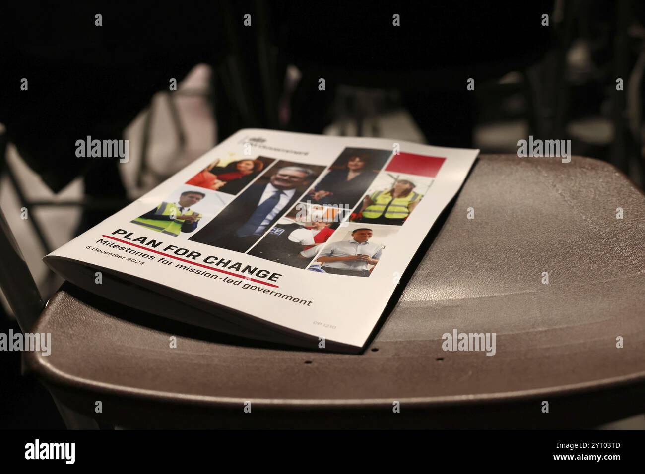 A programme lies on a chair before Britain's Prime Minister Keir ...