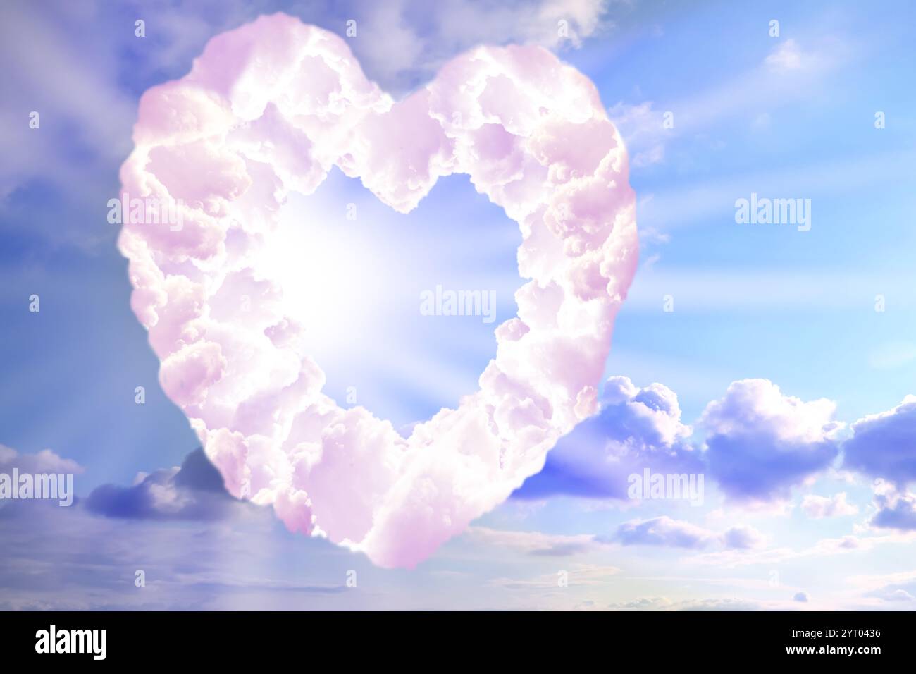 Bright light shining through heart made of clouds in sky. Love of God ...