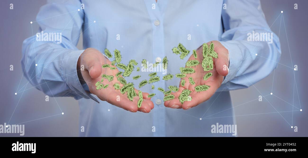 Man showing hands with microbes on grey background, closeup ...