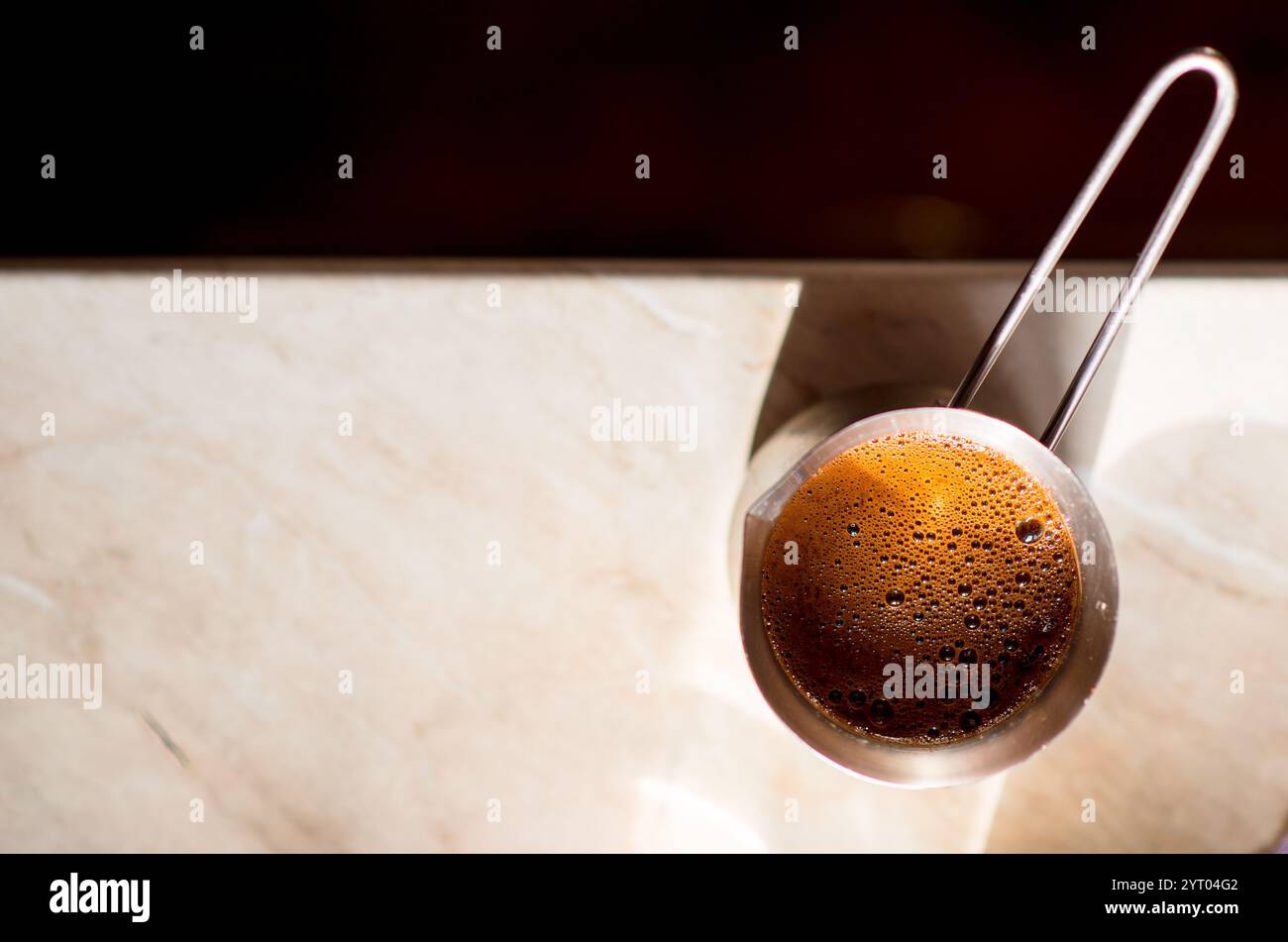 ready-made turkish coffee in a cezva in a turk on the table top view ...