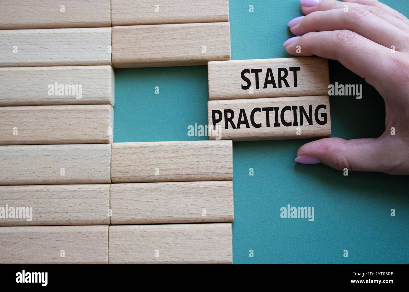 Start Practicing symbol. Concept word Start Practicing on wooden blocks ...