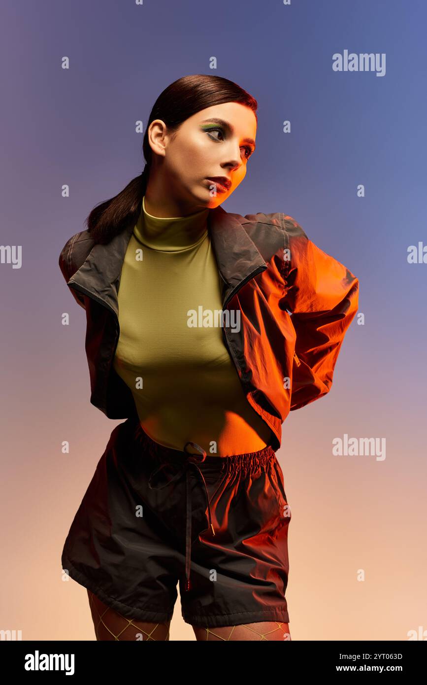 Young woman poses in a trendy outfit with striking makeup against a ...