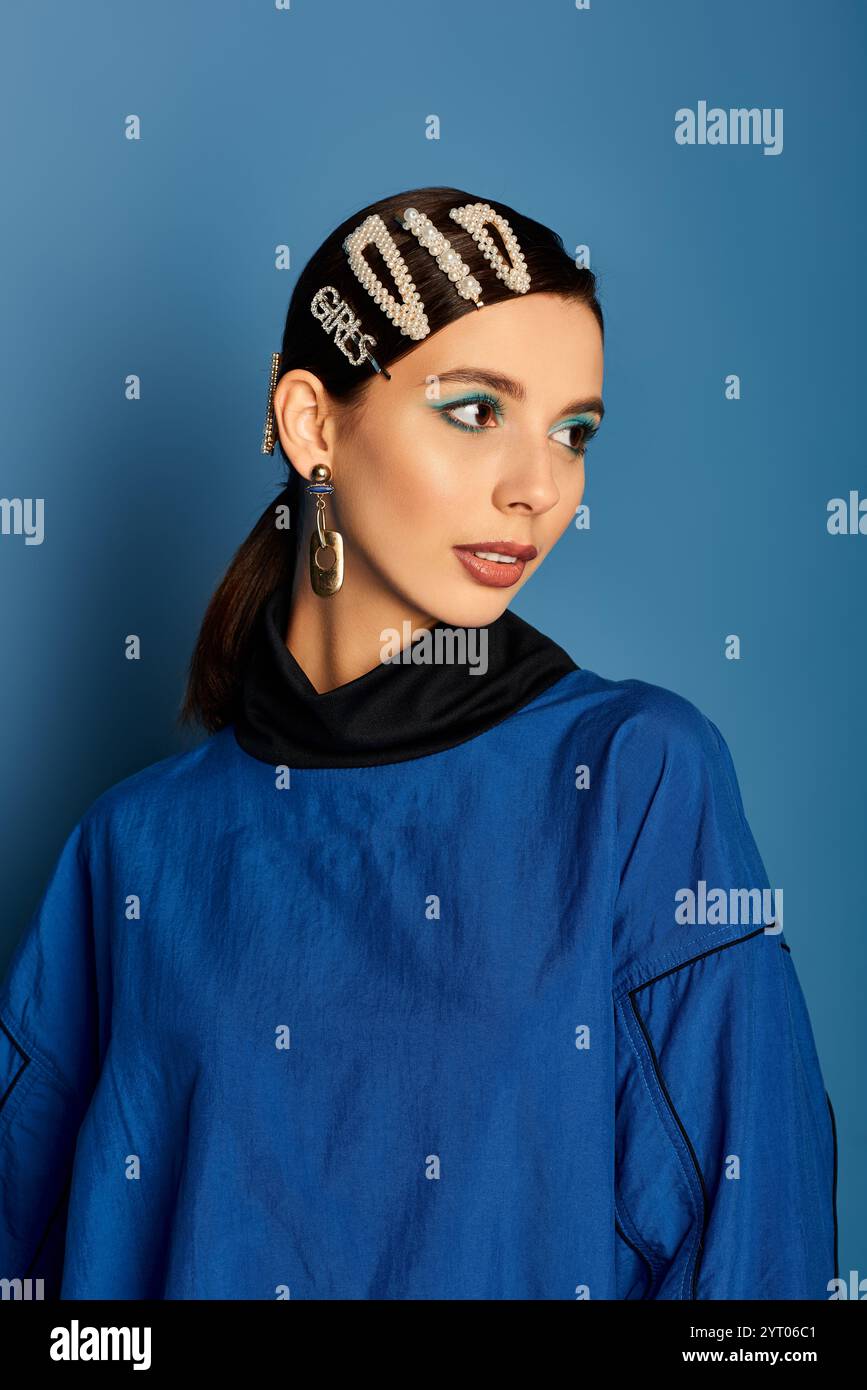 A beautiful young woman showcases her trendy attire and hair ...