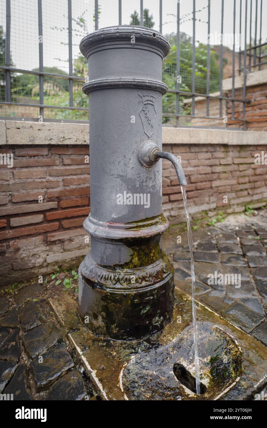 Typical ancient Roman drinking water fountain on street Stock Photo - Alamy