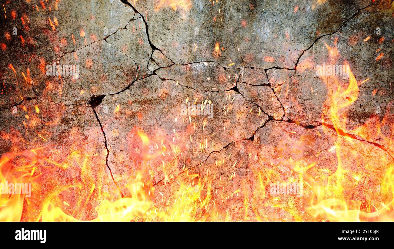 Flame of fire with sparks near grey d concrete damaged cracked wall ...