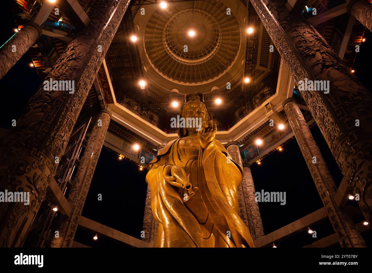 A large bronze statue of guanyin (Goddes of Mercy) statue with a ...