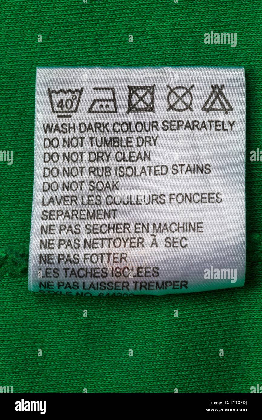 wash care instructions and symbols on label on green Dash jumper top ...