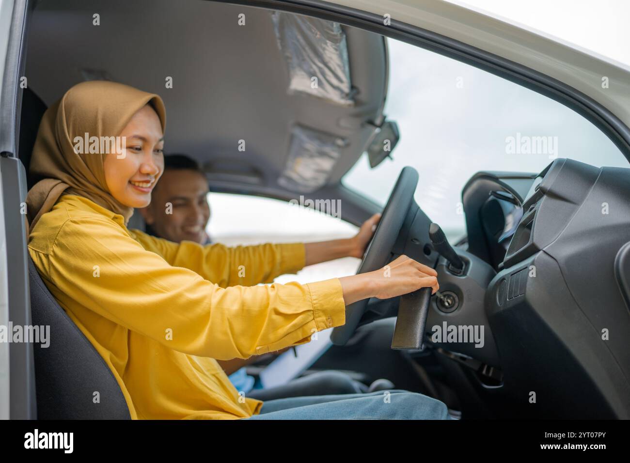 Woman joyfully driving car hi-res stock photography and images - Alamy