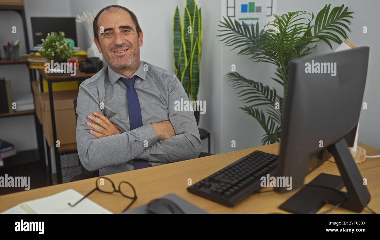 A smiling hispanic elderly man in an office setting, dressed in ...