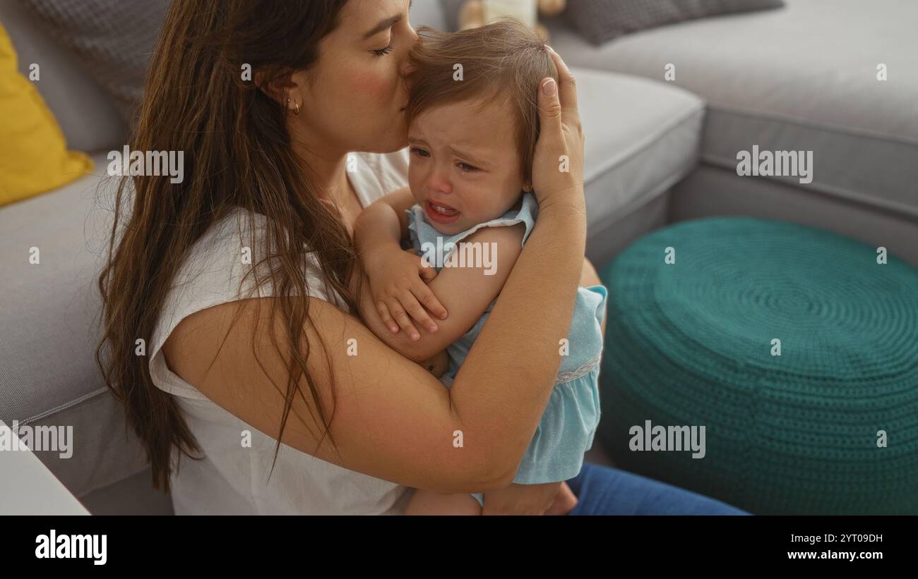 Woman comforting crying toddler girl in living room showing love and affection Stock Photo - Alamy